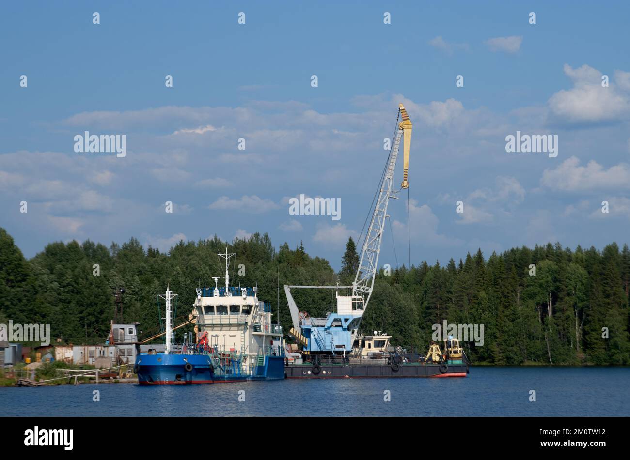 Cargo ships in the bay on a bright sunny day. Blue water and sky Stock ...