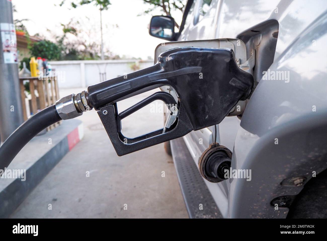 Orange and black oil nozzle Stock Photo - Alamy