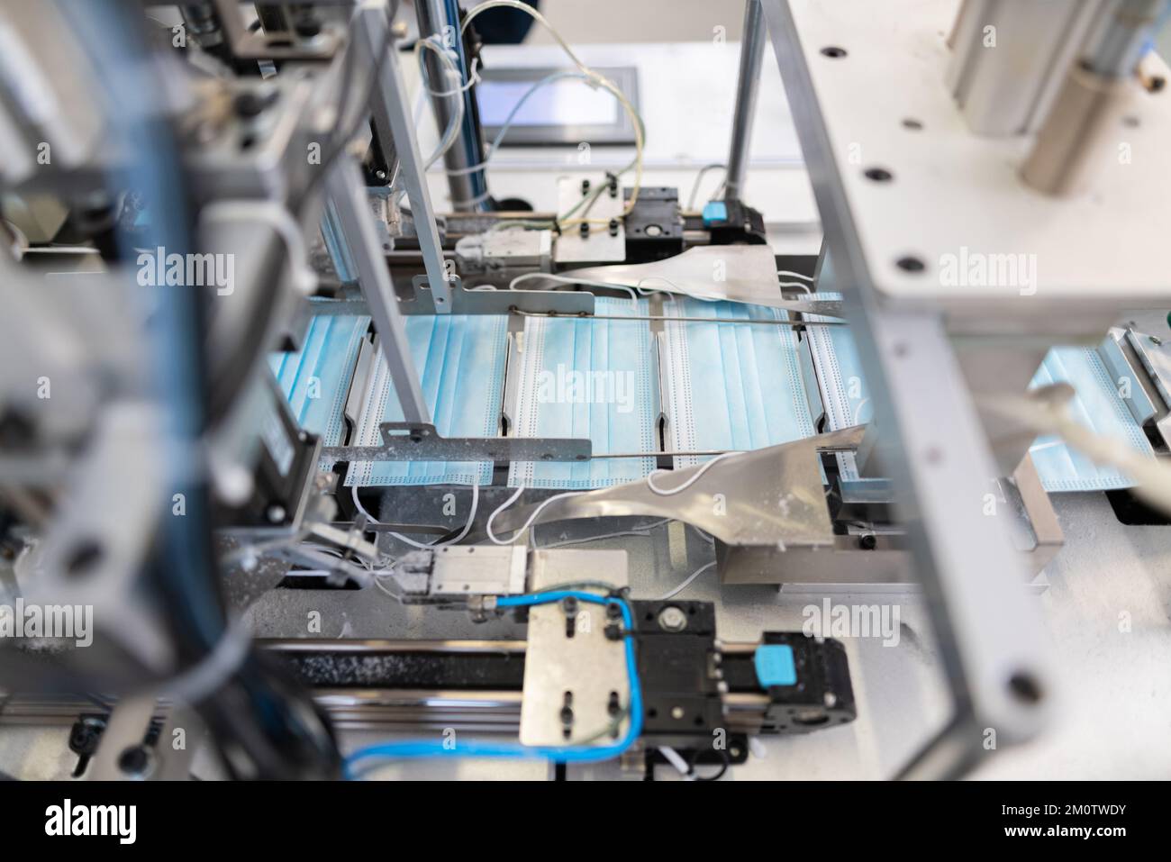 Closeup process of medical face masks being made in a factory ...