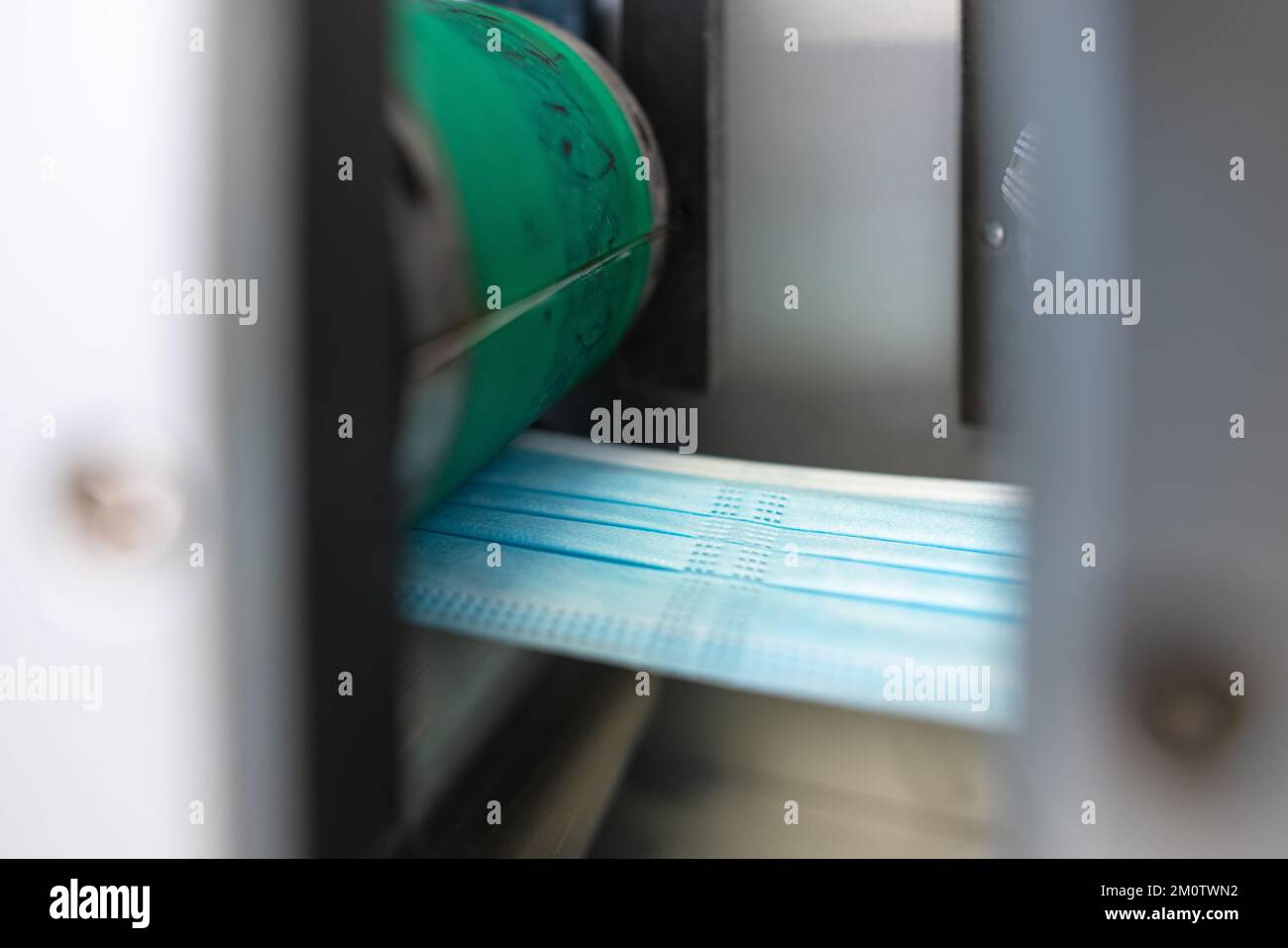 Closeup process of medical face masks being made in a factory ...
