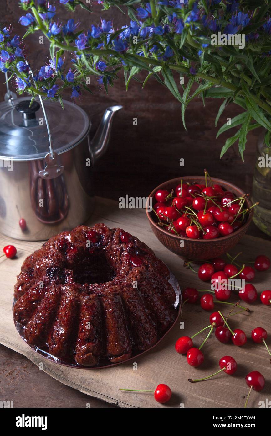 Composition on dark wooden background - delicious chocolate cake with ...
