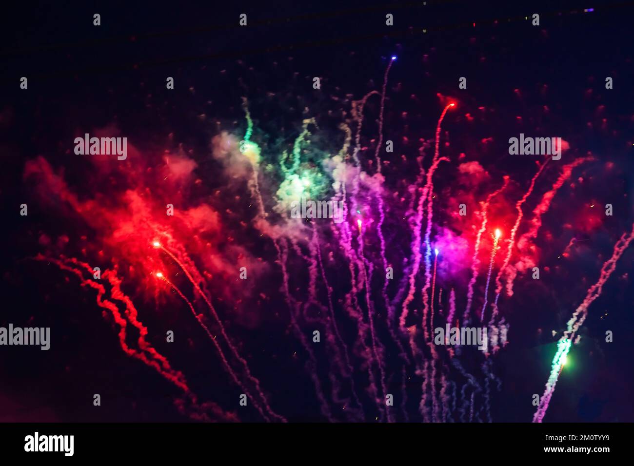 Beautiful multi-colored fireworks against the background of the night ...