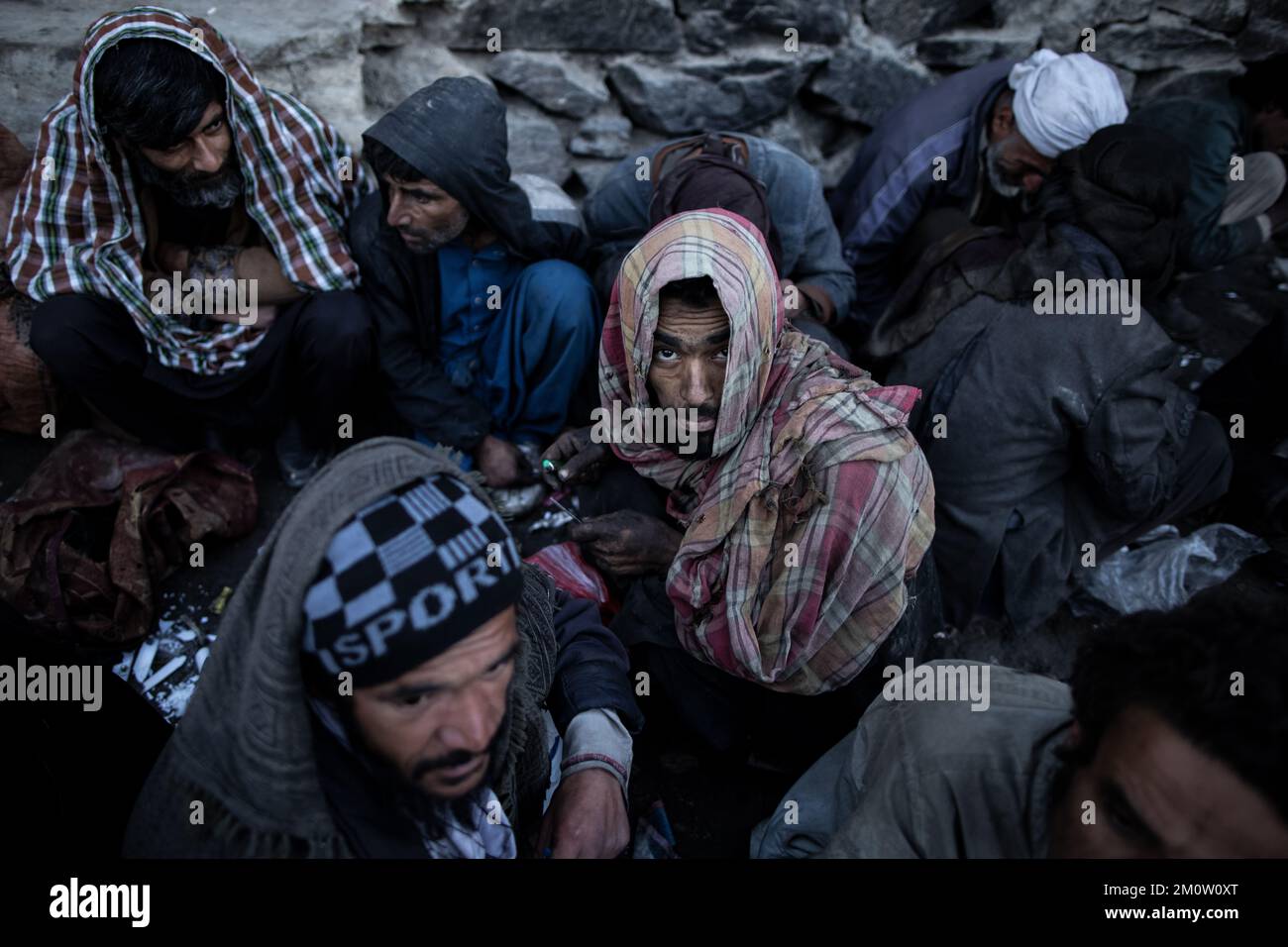 Kabul, Afghanistan. 14th Nov, 2022. Afghan men consume drugs on a ...