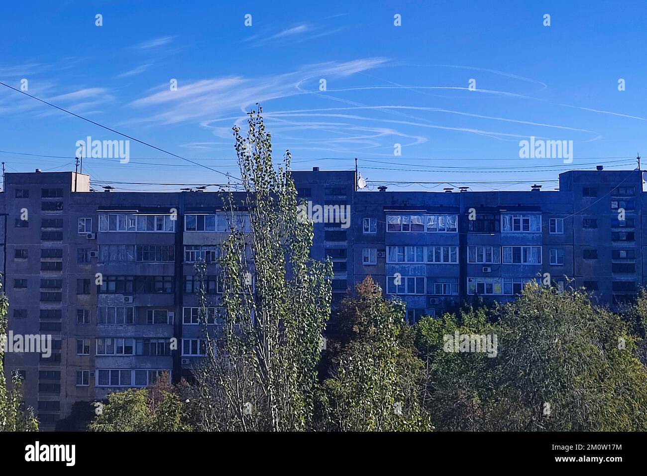 A high-rise house on a blue sky background Stock Photo - Alamy