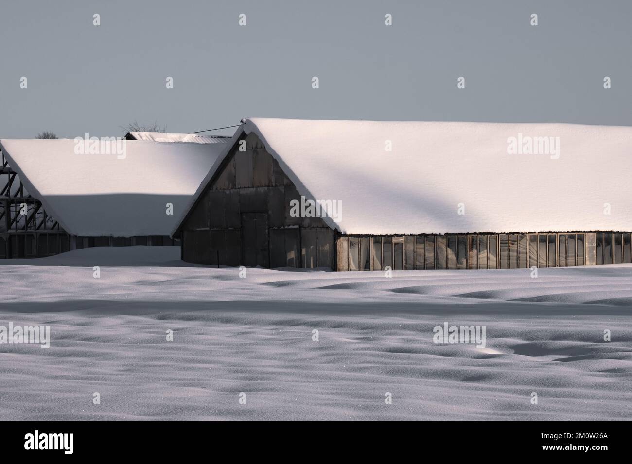 Snow-covered houses in the village. High quality photo Stock Photo - Alamy