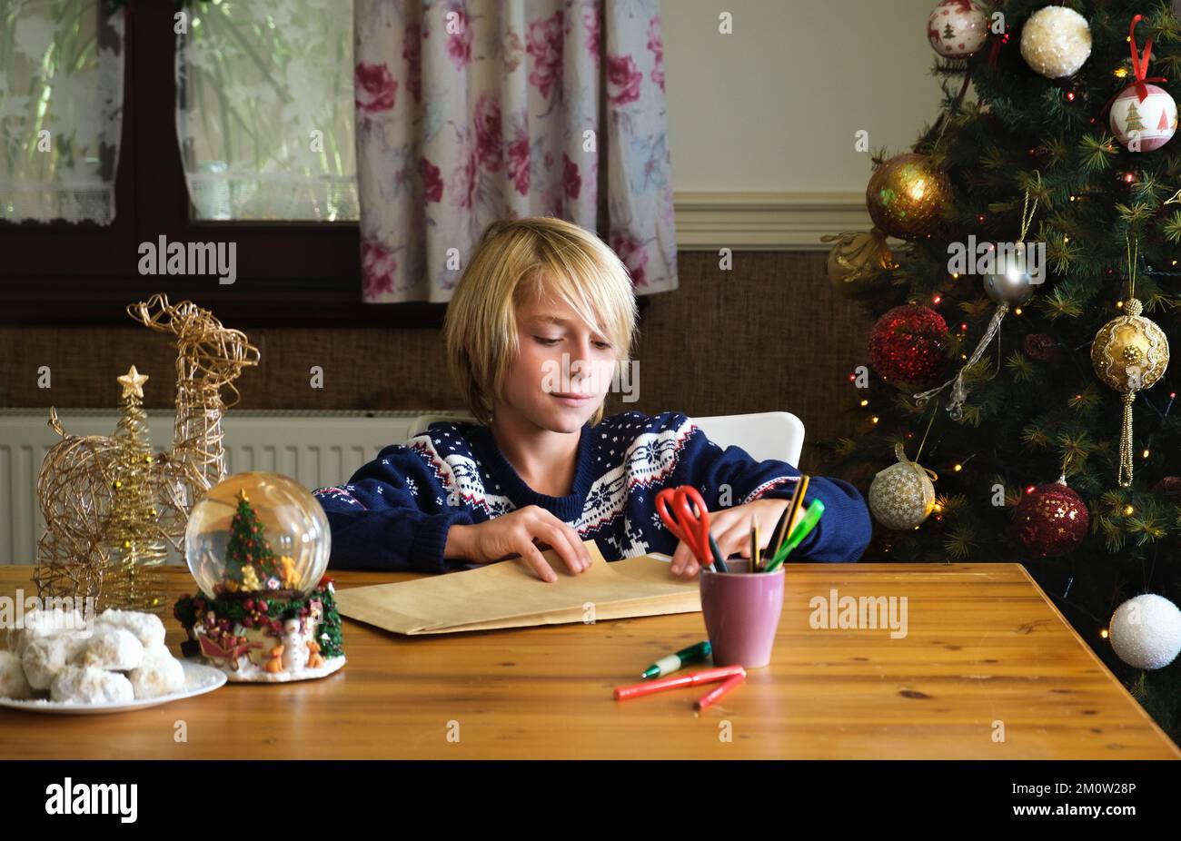 Kid writing letter to Santa Clause Stock Photo - Alamy