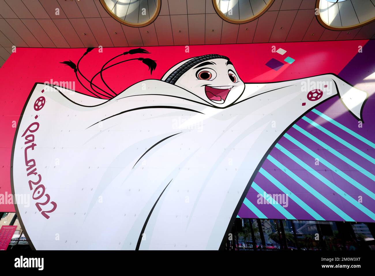 A wall with an image of FIFA World Cup 2022 mascot La'eeb at the Doha ...