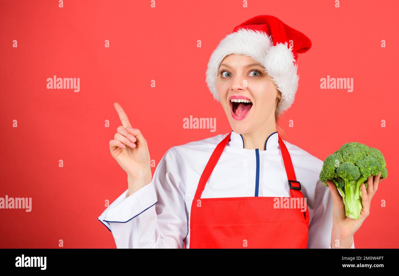 Christmas menu. Woman chef cooking christmas dinner wear santa hat ...