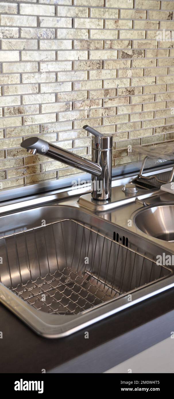 Interior of luxurious modern kitchen and stainless steel sink, tap and ...