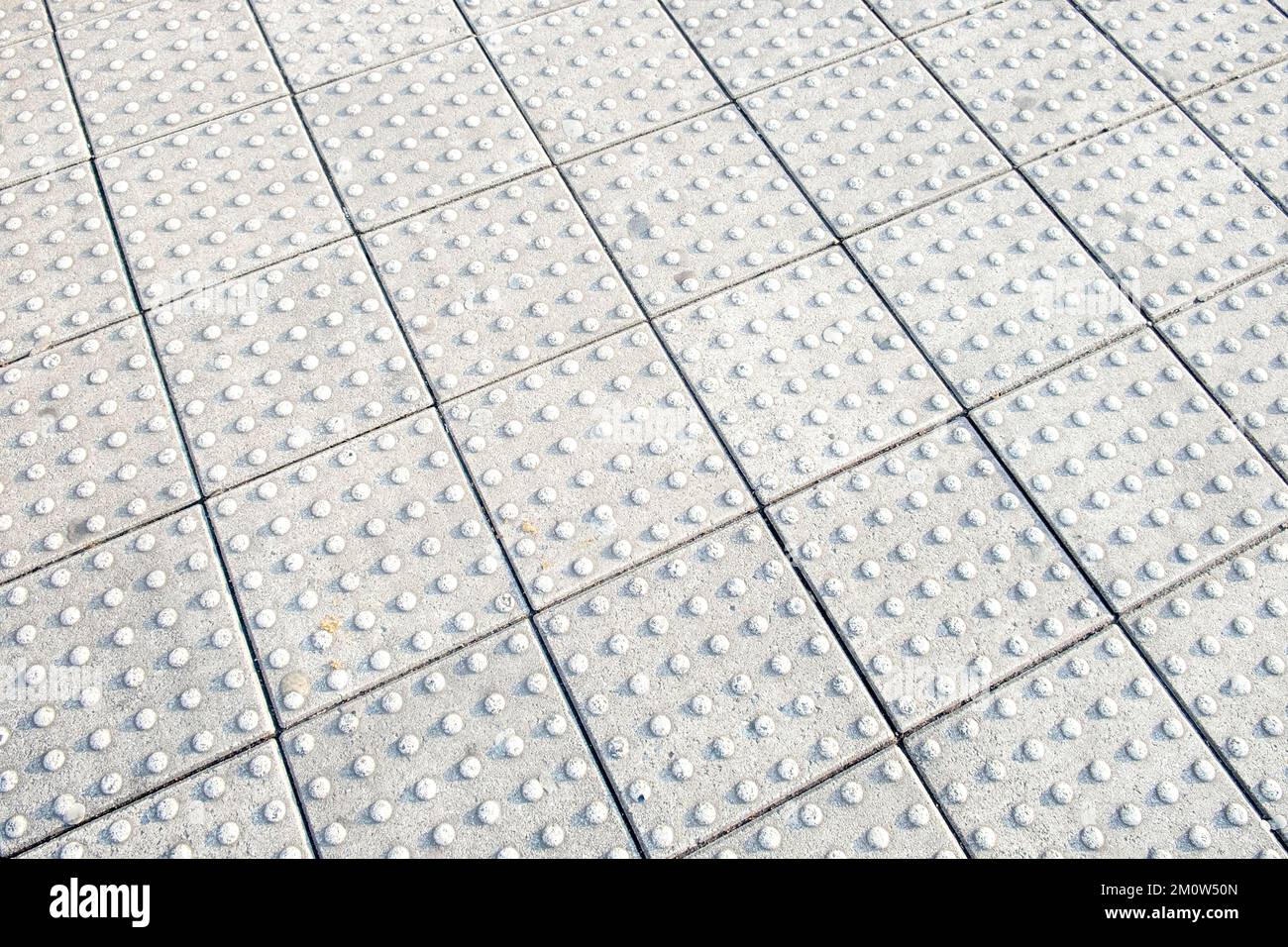 geometric pattern of grey floor tiles with anti slippery structure in ...