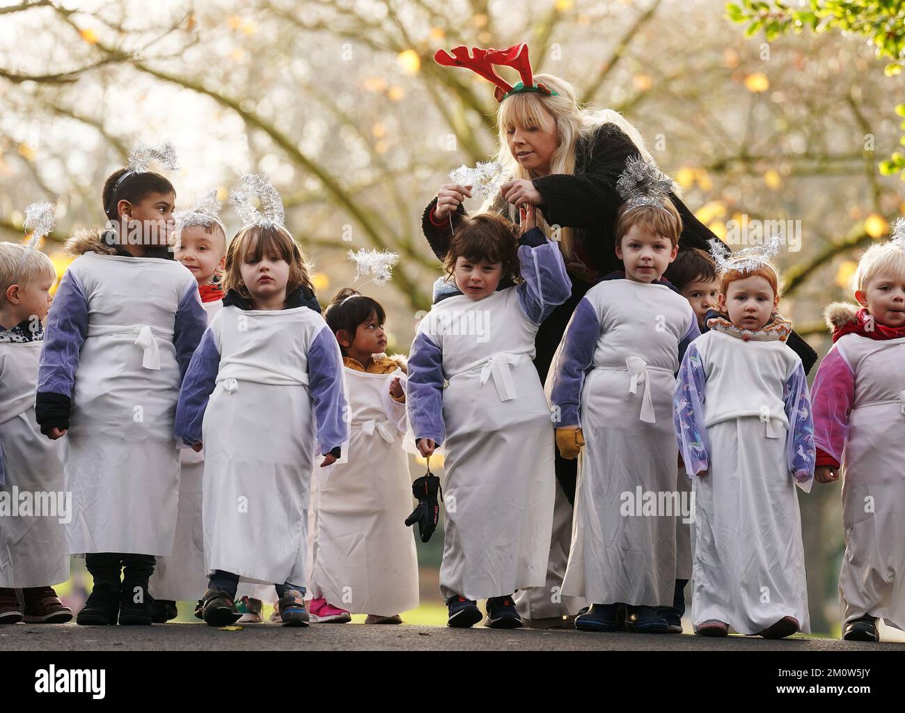 Pre school teacher Robyn Slattery adjust a halo as children from the ...