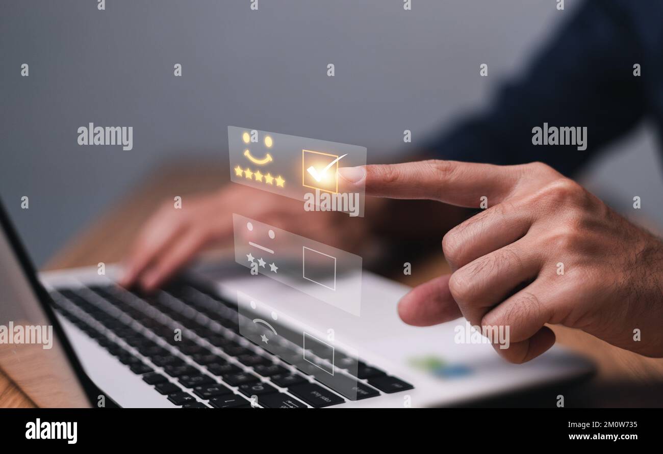 Businessman pressing smiley face emoticon on virtual touch screen ...