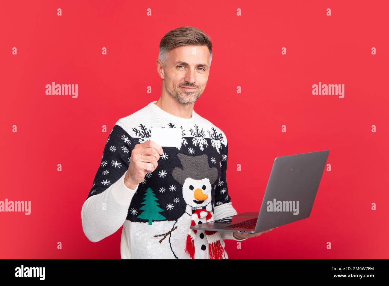 Winter business man with laptop and credit card. Man in Christmas ...