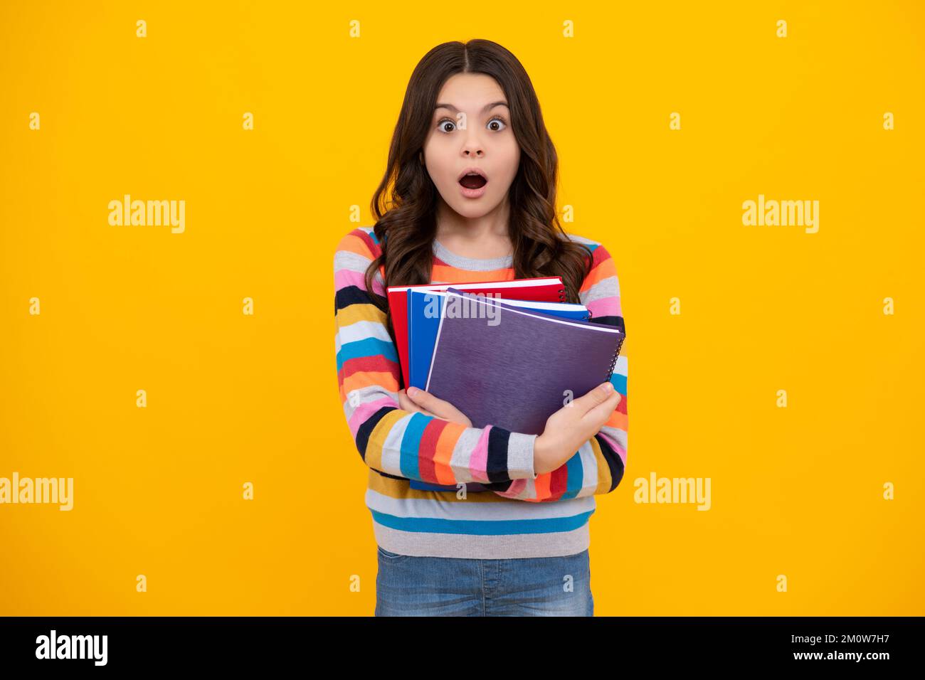 Schoolgirl with copy book posing on isolated background. Literature ...