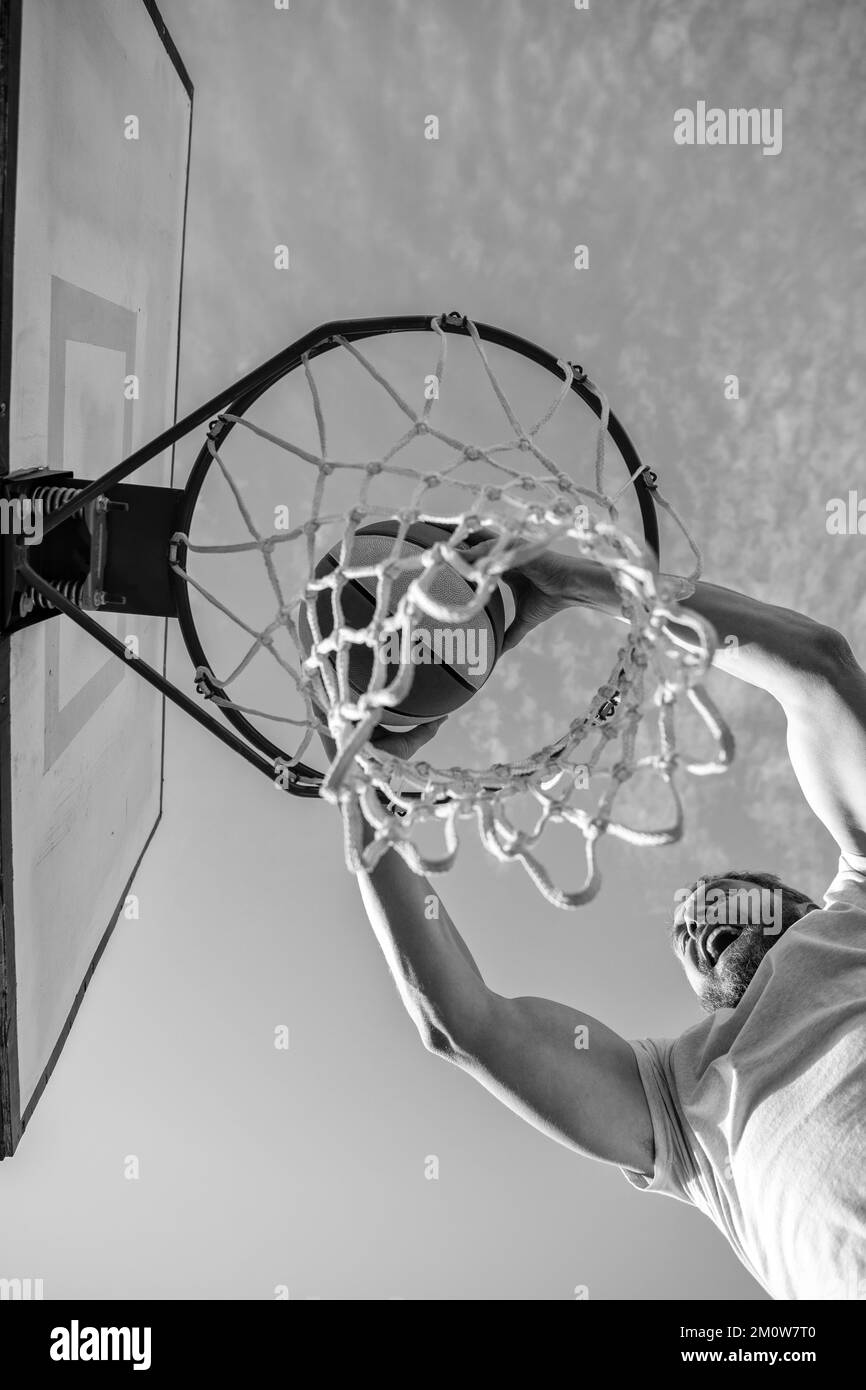 successful man with basketball ball on court. professional basketball ...