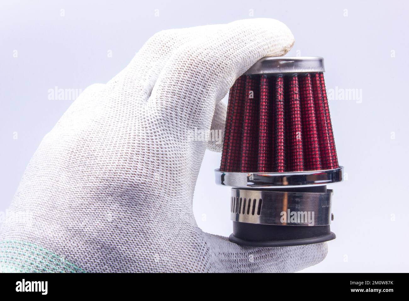 Conical chrome air filter with red mesh - tuning accessory on a gray ...