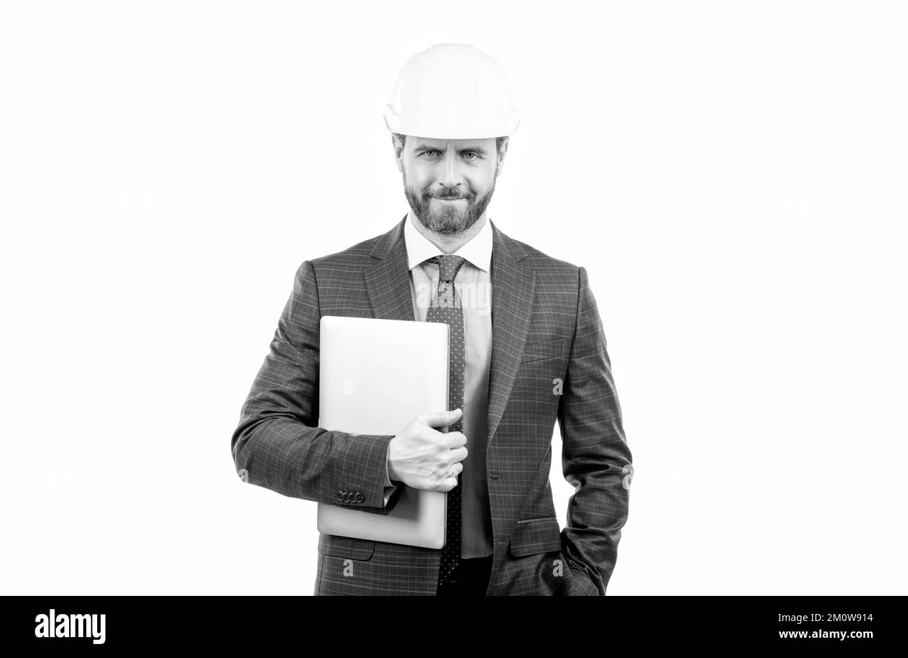 confident businessman man in suit and safety helmet hold computer ...