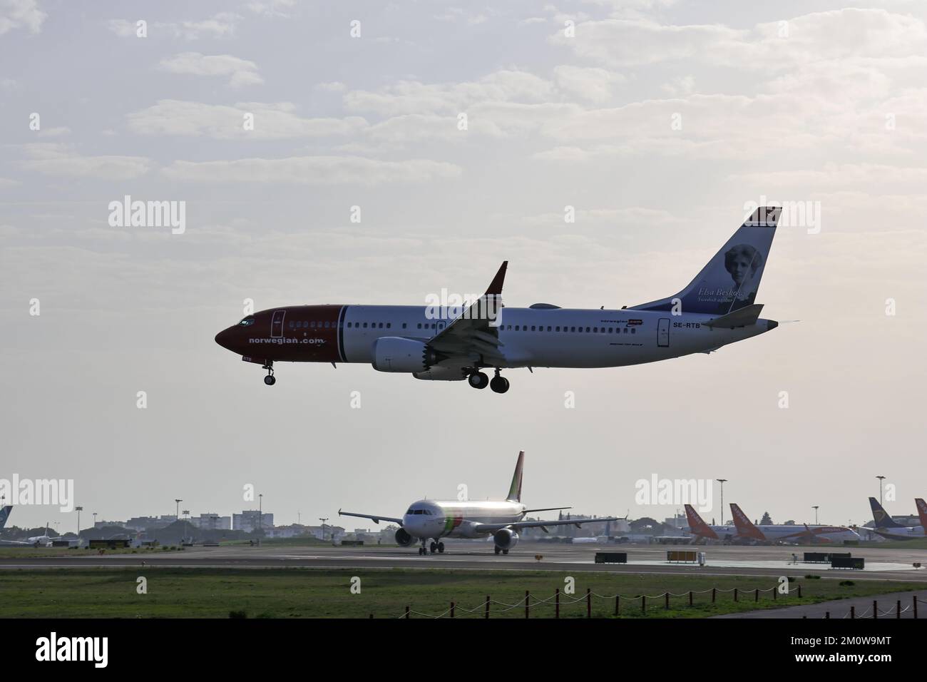 A low-angle of a Boeing 737 MAX 8 airplane of Norwegian (Elsa Beskow ...