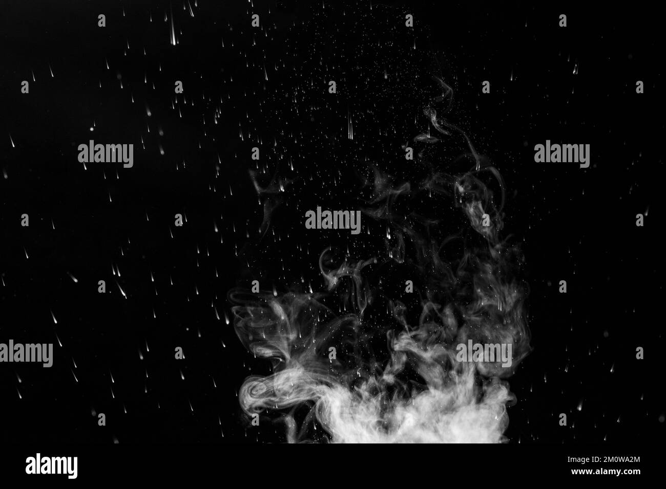 A jet of hot steam with splashes. The movement of hot steam with water ...