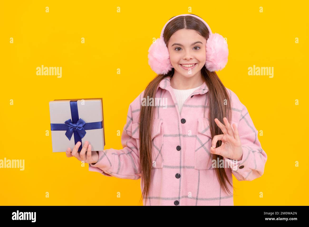 I got it. Happy girl show OK gesture holding present box. Gift delivery ...