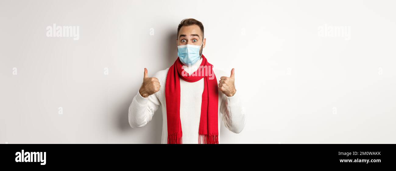 Covid-19, lockdown and quarantine concept. Surprised man in face mask ...