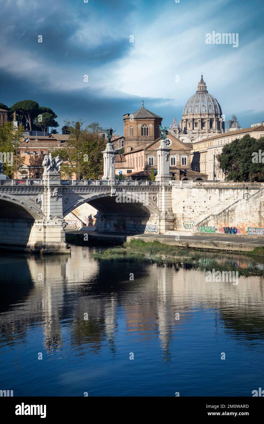 The Tiber River flows through Rome with St. Peters Basilica of Vatican ...