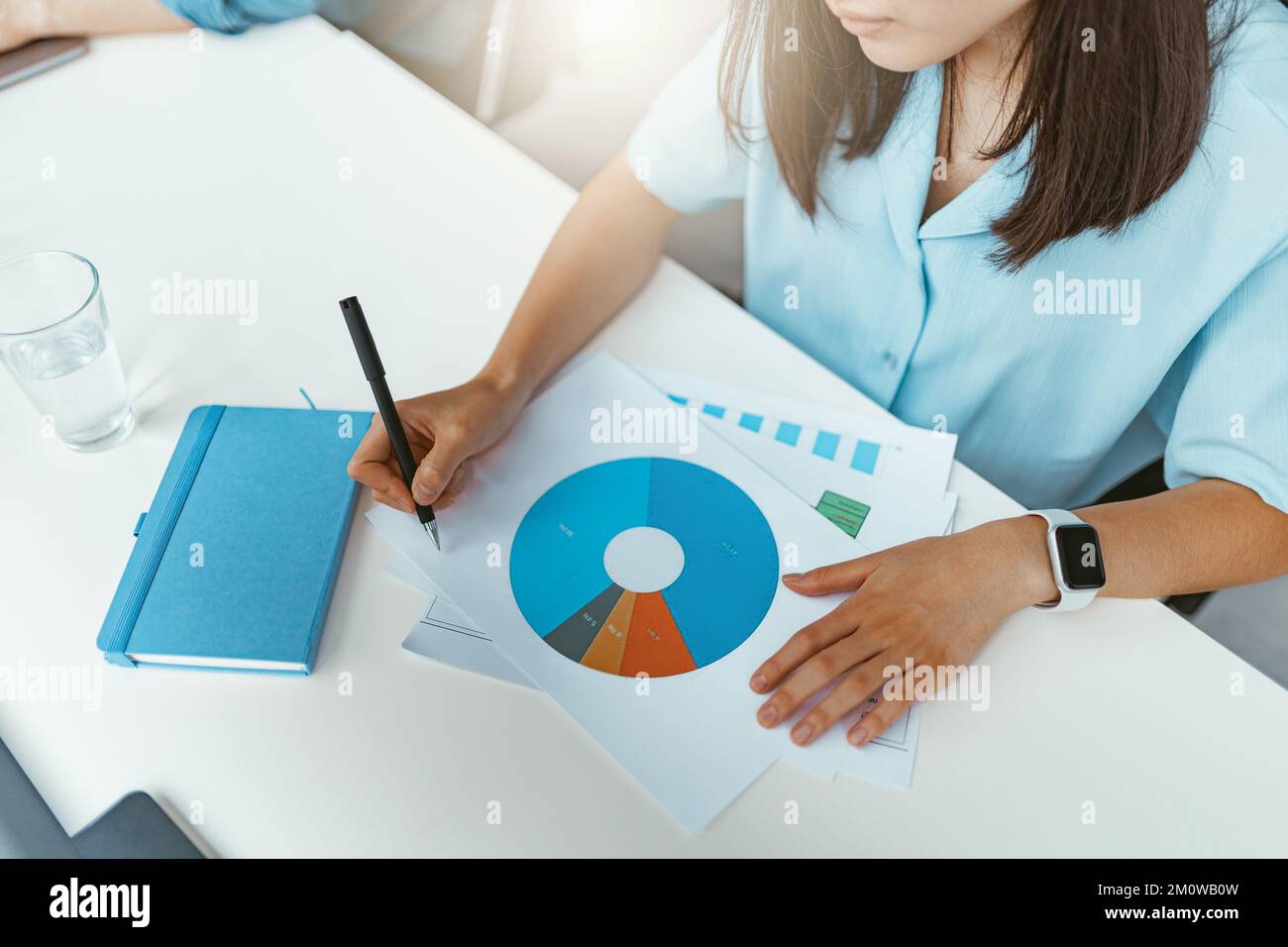 Close up of businesswoman working with documents and making notes Stock ...