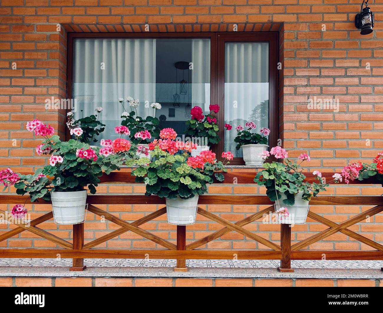 Glass window with many flowers at luxury villa Stock Photo - Alamy