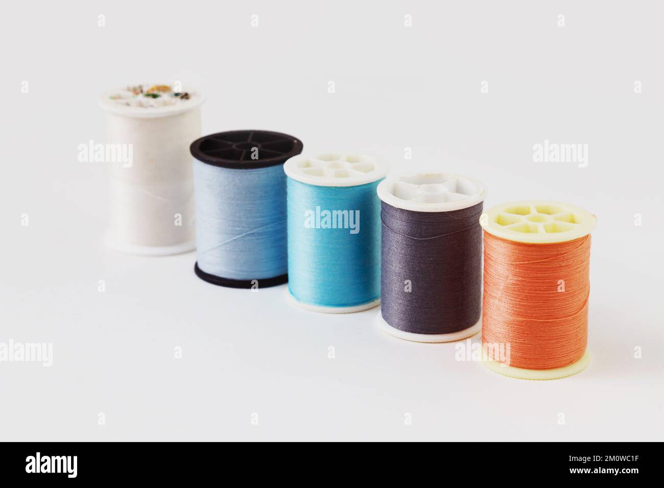 Yarn textile, Spool of colorful clothes sewing thread isolated on white ...