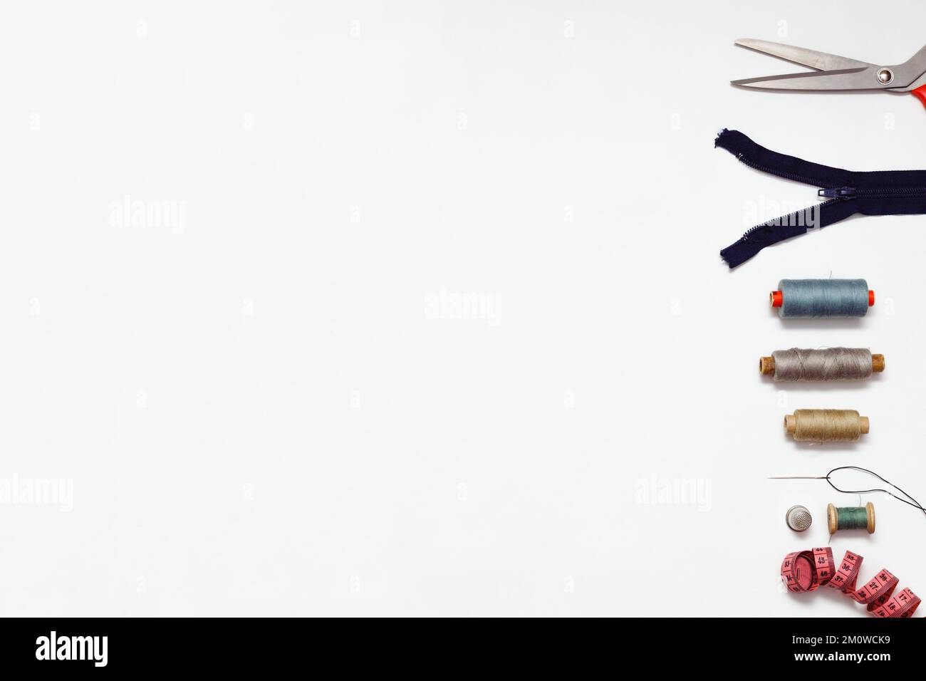 Linen textiles, scissors and sewing supplies on white desk Stock Photo ...