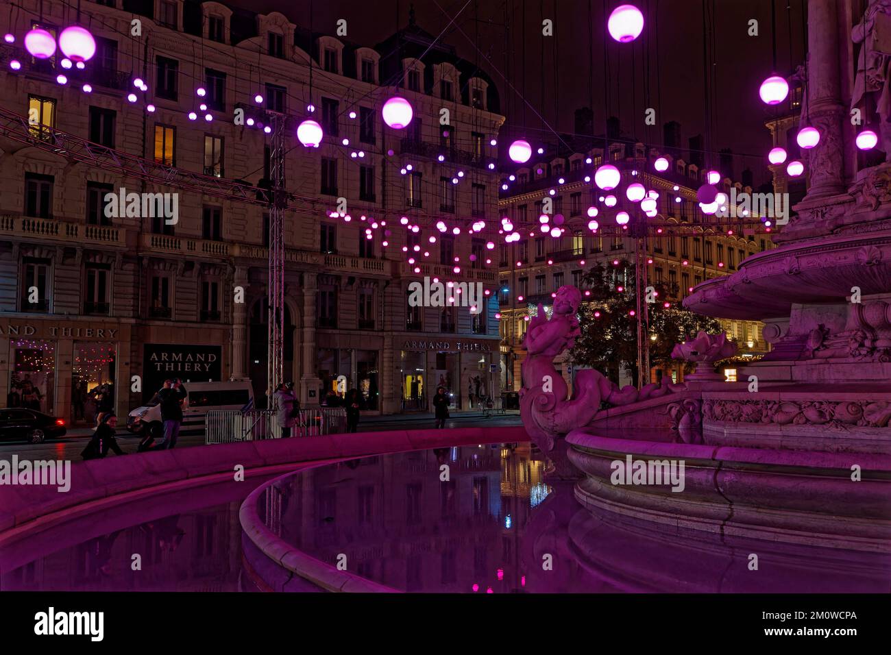 LYON, FRANCE, December 7, 2022 : Fountain of Place des Jacobins during Festival of Lights. The ...