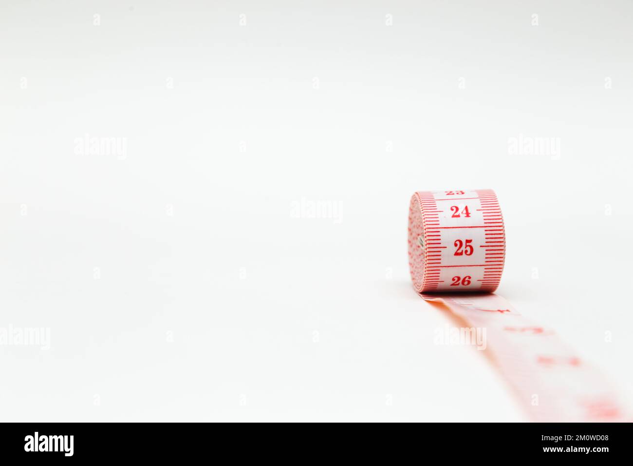 Tape Measure Rolled Isolated on White with Copyspace. 25 centimeters on ...