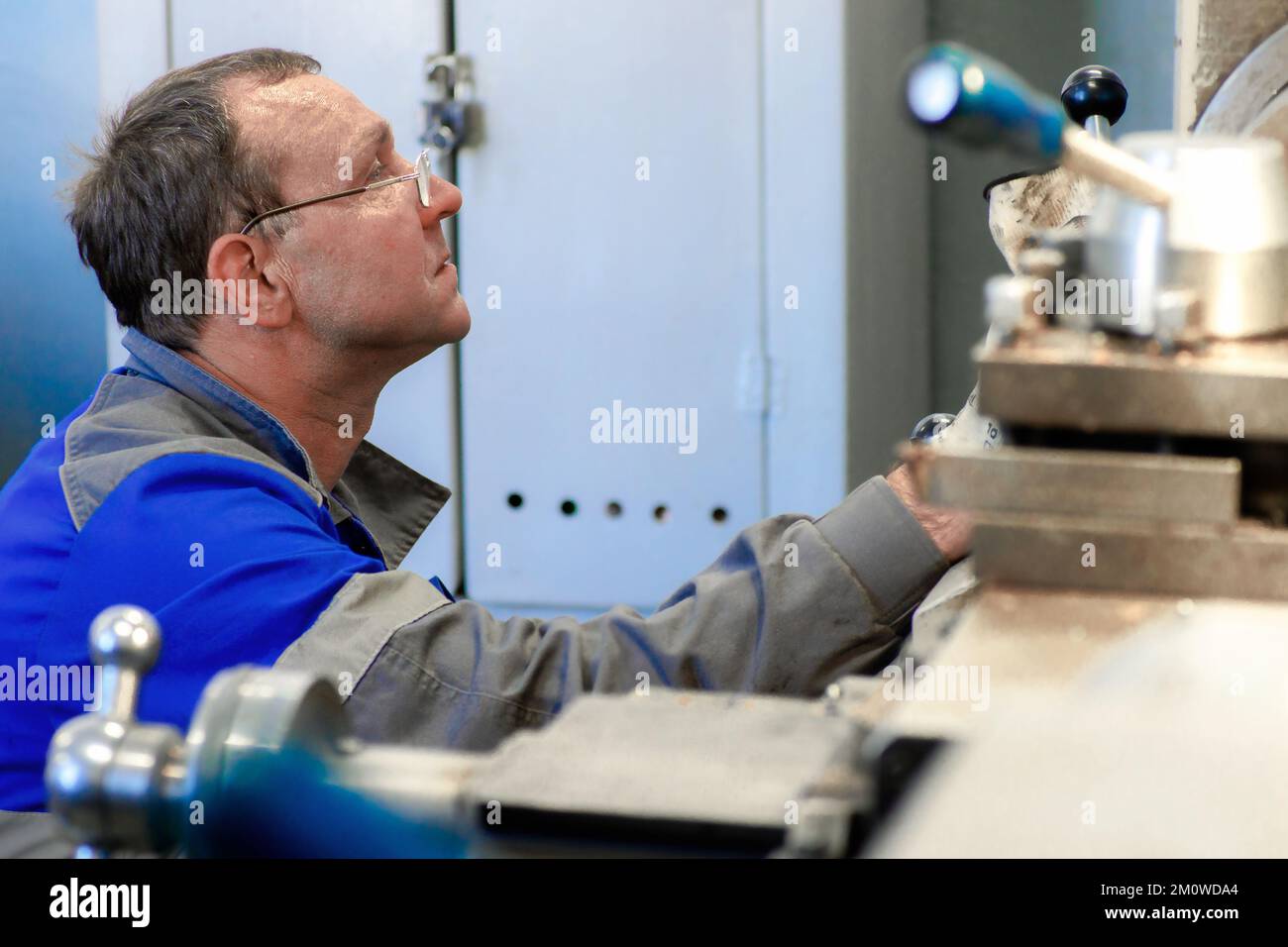 Lathe operator working in factory hi-res stock photography and images ...
