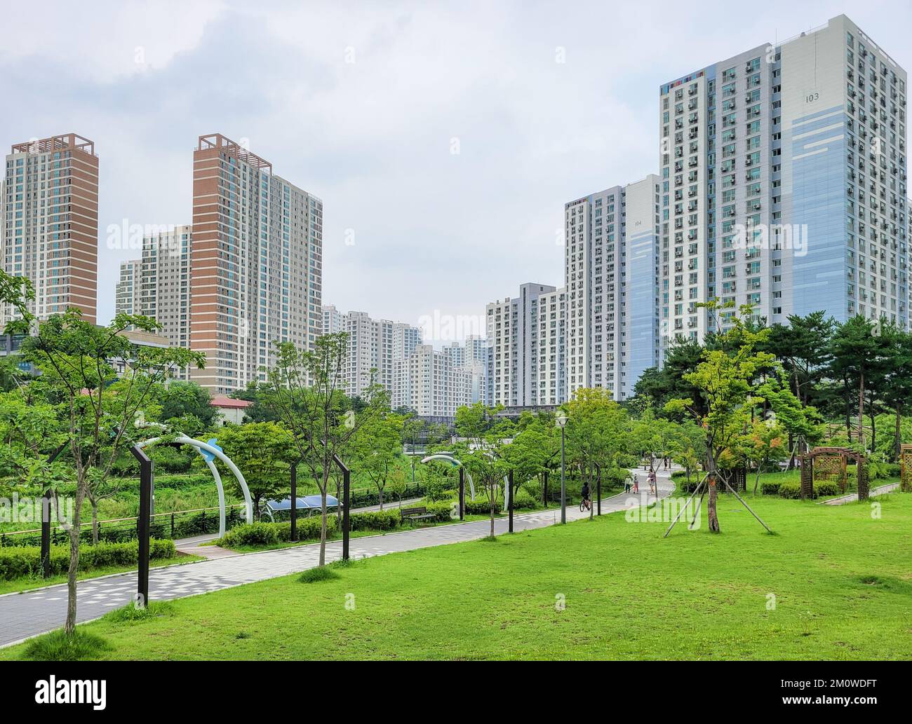 Calm and peaceful park surrounded by high rise apartment building in ...