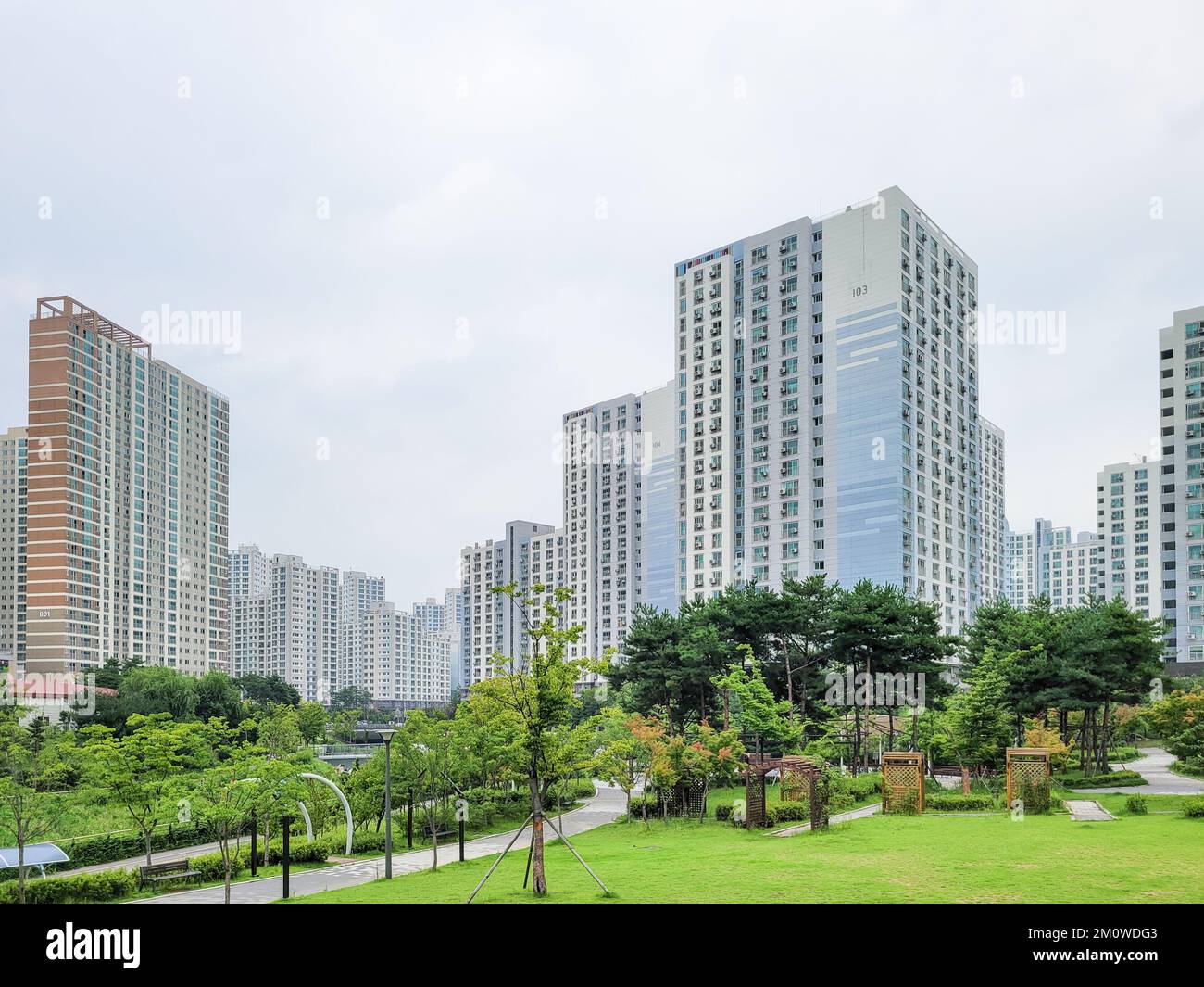 Calm and peaceful park surrounded by high rise apartment building in ...