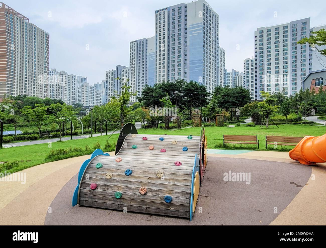 Calm and peaceful park surrounded by high rise apartment building in ...