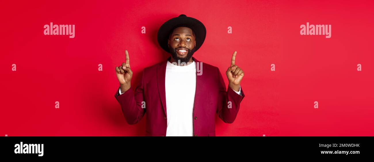 Winter holidays and shopping concept. Happy african american man ...