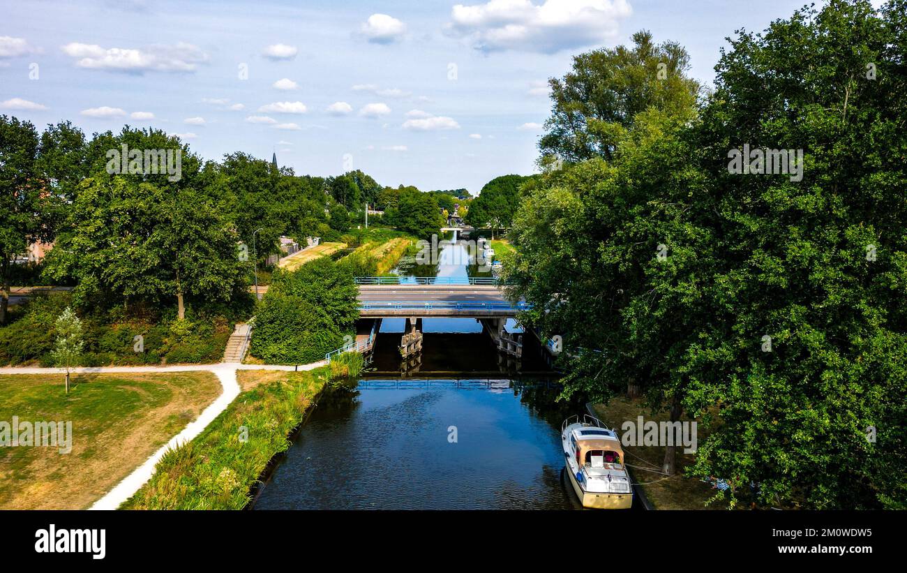 An aerial shot of a small bridge over a river in Heerenveen town ...