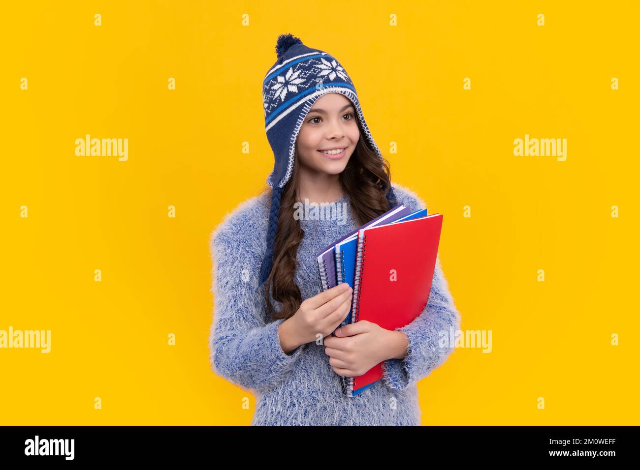 School children in winter hat and sweater with school books on isolated ...