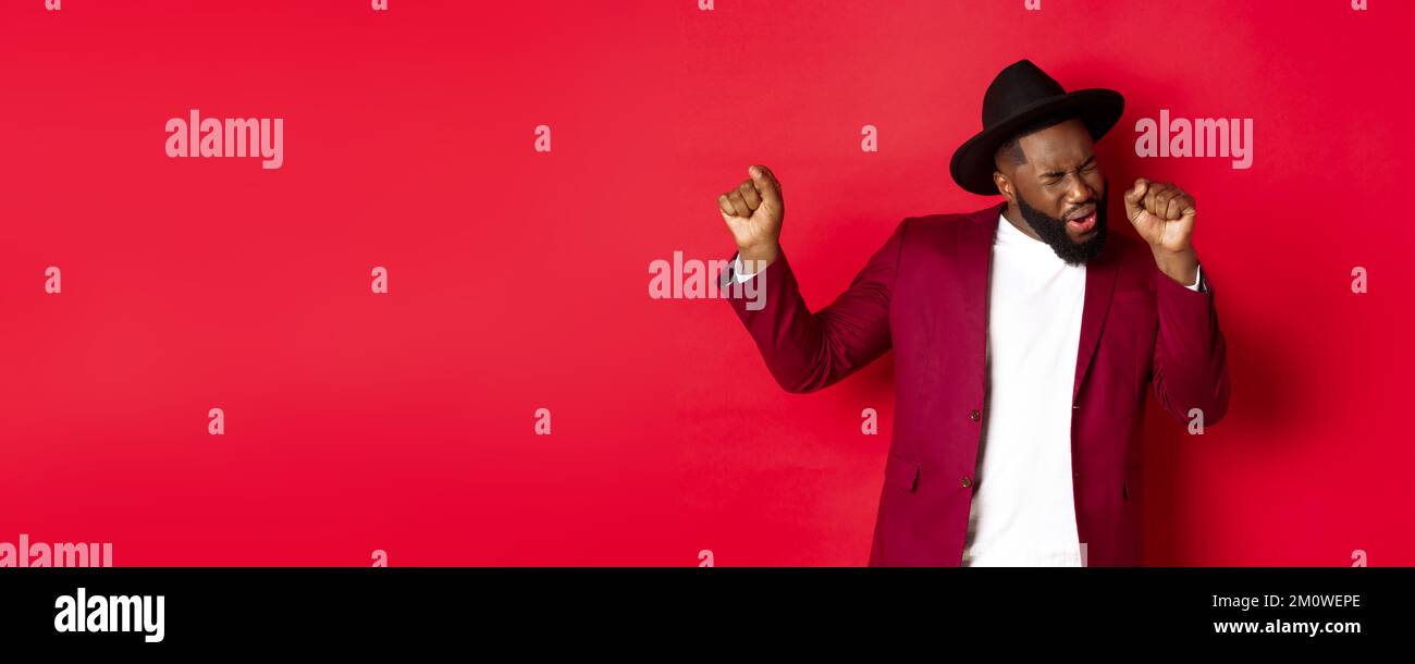 Christmas and people concept. Happy Black man celebrating New Year and ...