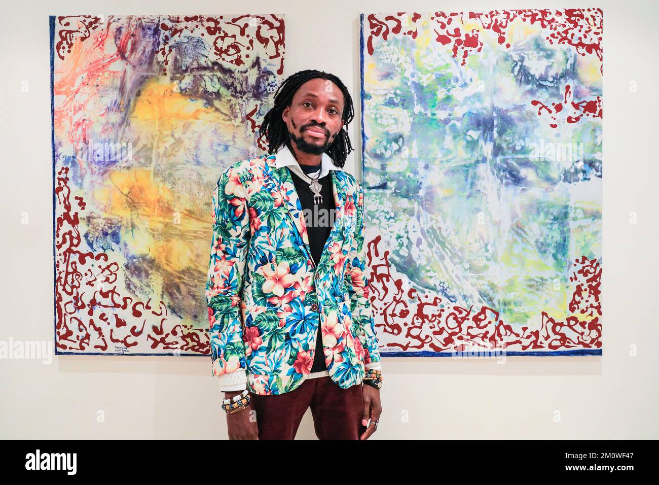 London, UK. 08th Dec, 2022. The artist with Ancestral Writing I and ...