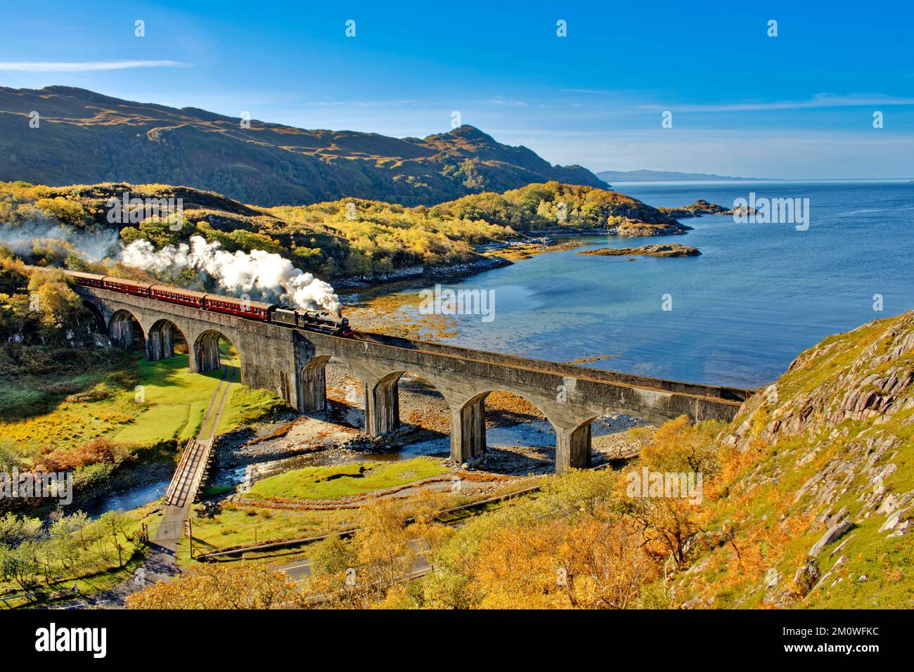 Jacobite Steam Train with smoke on the Nan Uamh Viaduct West Coast ...