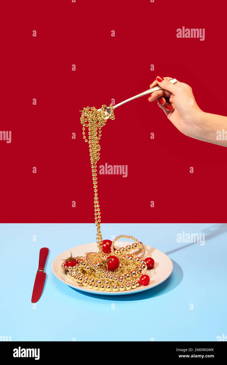 Female hand spinning on fork necklace symbolizing spaghetti in bright ...