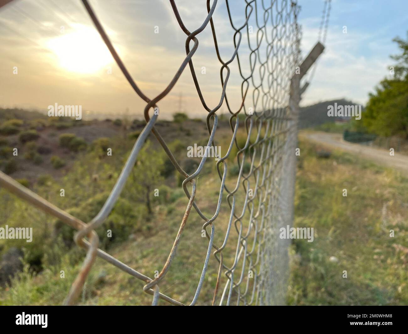 Barbed wire fence top wall hi-res stock photography and images - Alamy
