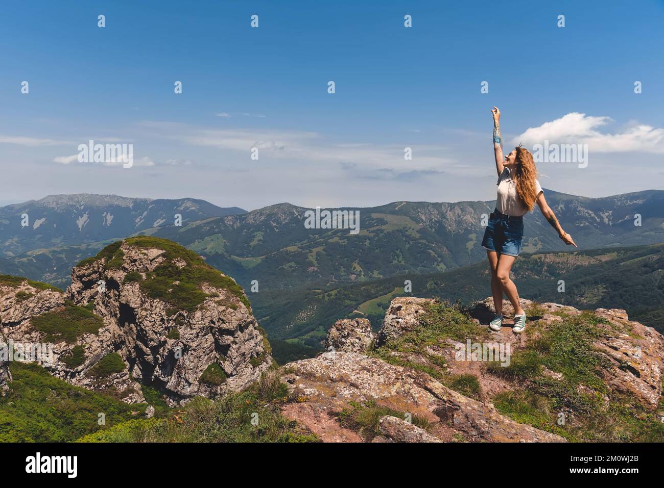 Hiker celebrating on top mountain hi-res stock photography and images ...