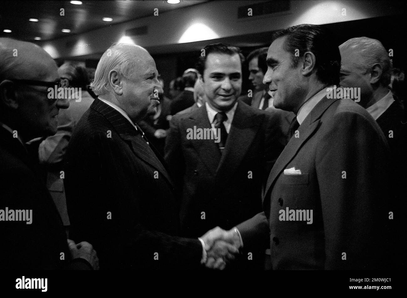 Argentine Navy Commander Eduardo Emilio Massera (right) greets ...