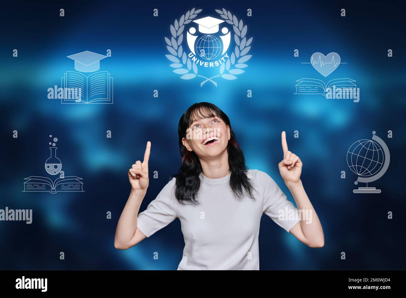 Teenage girl pointing with her hands at symbol of university Stock ...