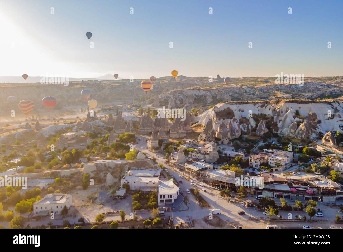 Colorful hot air balloons flying over at fairy chimneys valley in ...