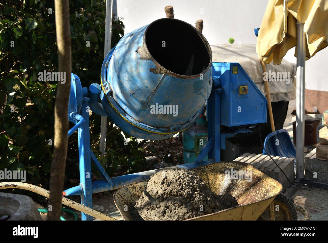 Detail of a hand-held concrete temperer during house construction Stock ...