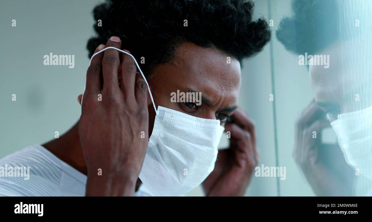 African man removing mask prevention hi-res stock photography and ...